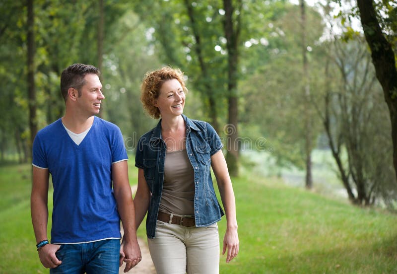 Happy Couple Walking Together Outdoors Stock Photo - Image of happy ...