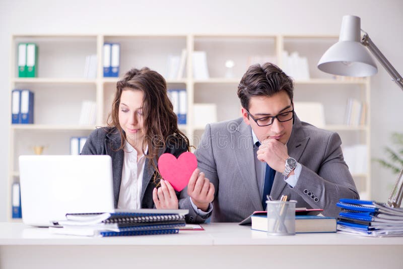 The Happy Couple Working in the Same Office Stock Image - Image of ...