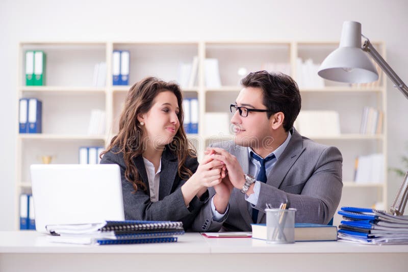 The Happy Couple Working in the Same Office Stock Photo - Image of ...