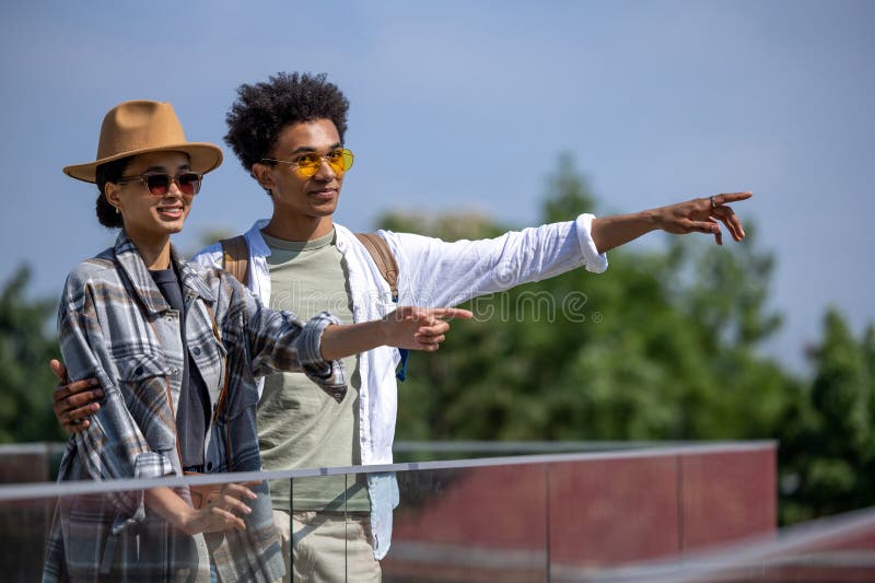 Young Couple Having a Walk and Looking Happy Stock Photo - Image of ...