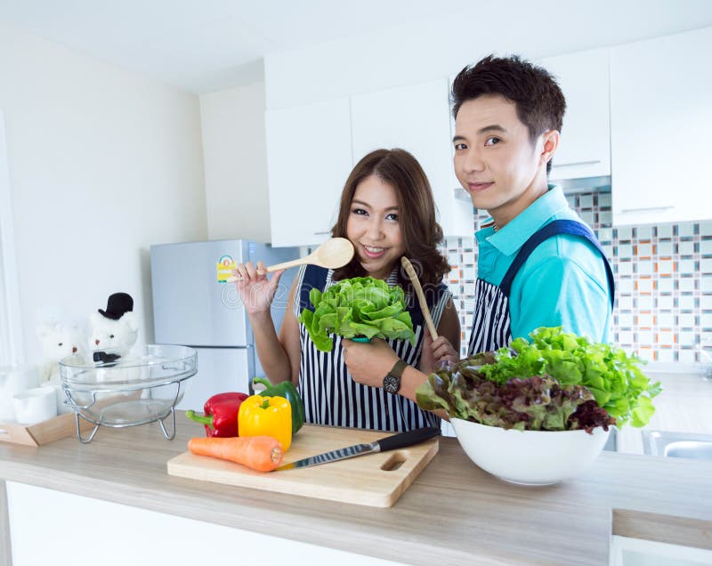 Happy couples in kitchen stock photo. Image of family - 30500070