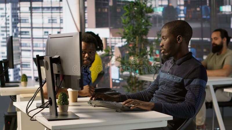 Happy Coworker in Wheelchair Bumping Fists with Programmer Stock Image ...