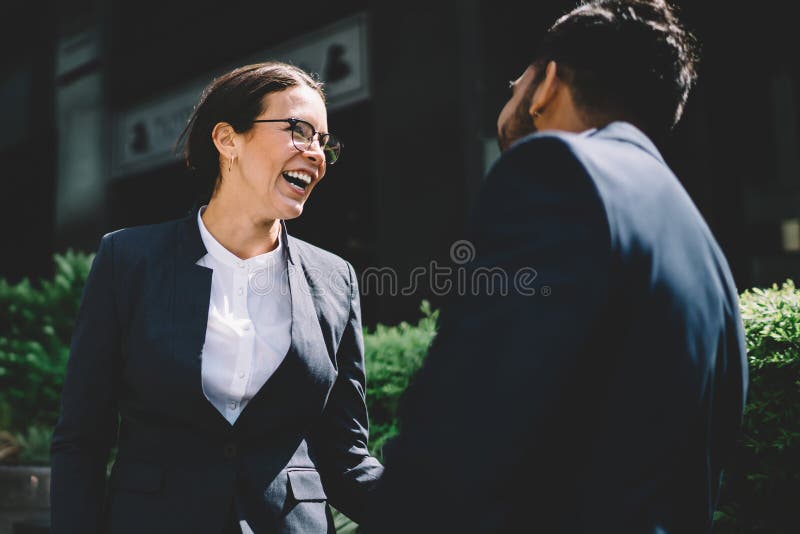 Happy Coworkers Laughing on Publicity Area during Work Break Stock ...