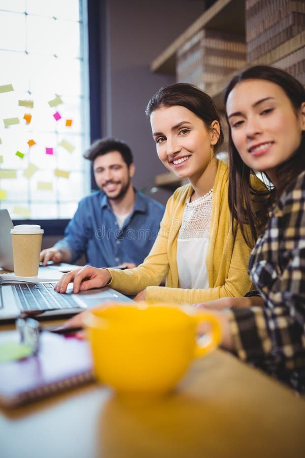 Happy Coworkers Working at Desk Stock Photo - Image of business, people ...