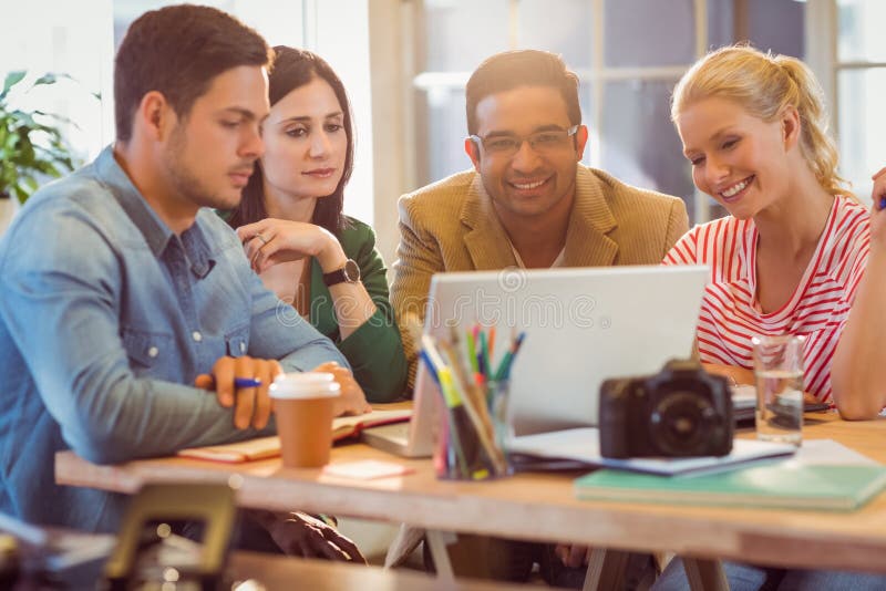 Happy Creative Business Team Gathered Around a Laptop Stock Image ...