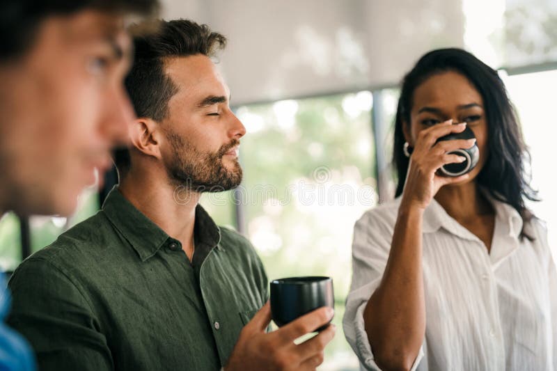 Happy Creative Diverse Colleagues Having Fun while Talking and Drinking ...