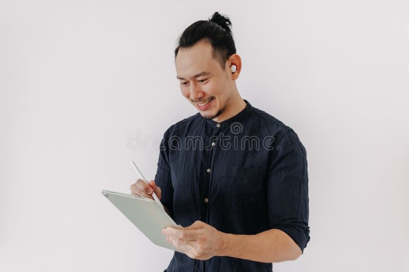 Happy Creative Freelance Man with Earbuds Work with Tablet Isolate on ...