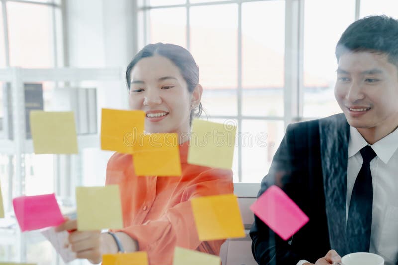 Happy People Making Mind Map on a Glass Wall in the Office Stock Photo ...