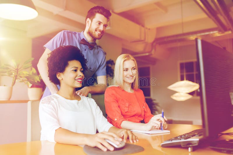 Happy Creative Team with Computer in Office Stock Image - Image of ...
