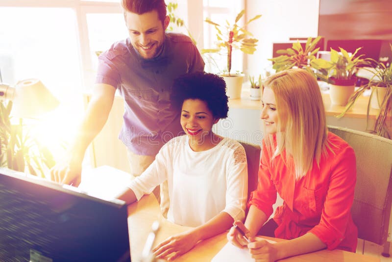 Happy Creative Team with Computer in Office Stock Photo - Image of ...