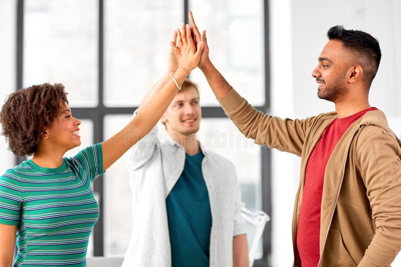 Happy Creative Team Making High Five at Office Stock Image - Image of ...