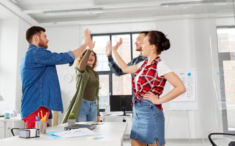Happy Creative Team Making High Five at Office Stock Photo - Image of ...