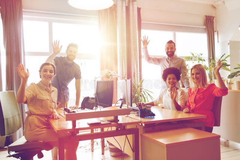 Happy Creative Team Waving Hands in Office Stock Image - Image of ...