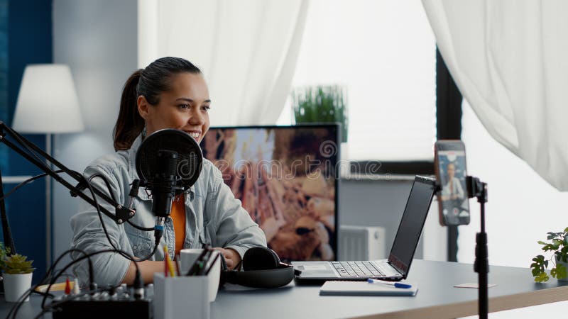 Happy Creator Sitting at Podcast Desk with Studio Microphone and ...