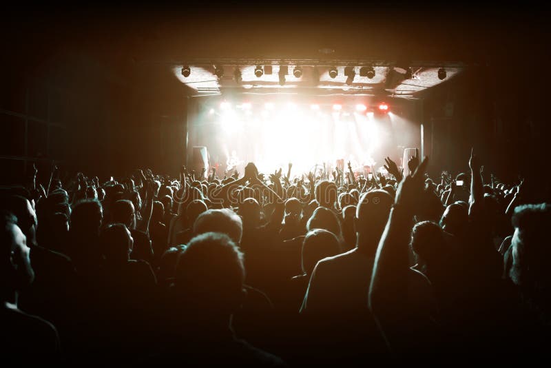 Happy Crowd with Raised Hands at a Rock Concert. Stock Image - Image of ...