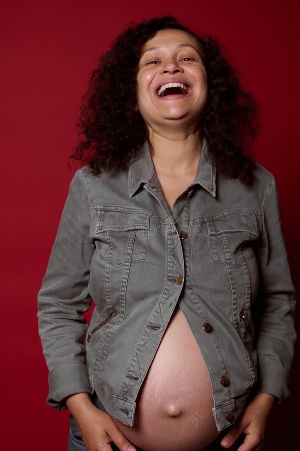 Happy Pregnant Woman With Naked Belly Wearing Stylish Casual Denim