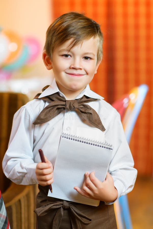 Little Boy Waiter Accepts the Order in a Cafe or Stock Photo - Image of ...