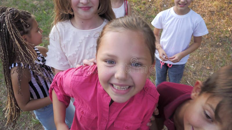 Happy Cute Kids Staring into Camera in Summer Park Stock Footage ...