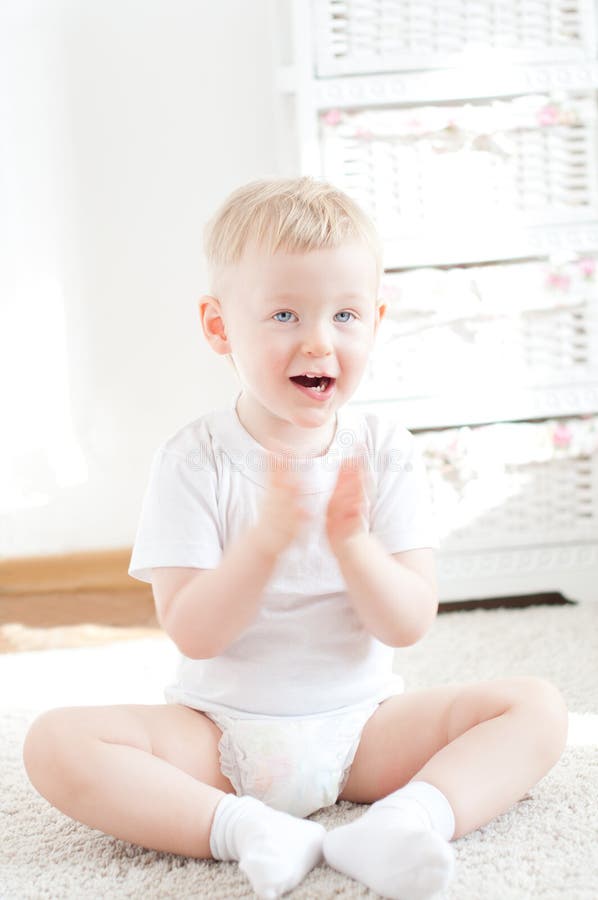 Beautiful Little Boy Laughing Clapping Stock Photos - Free & Royalty ...