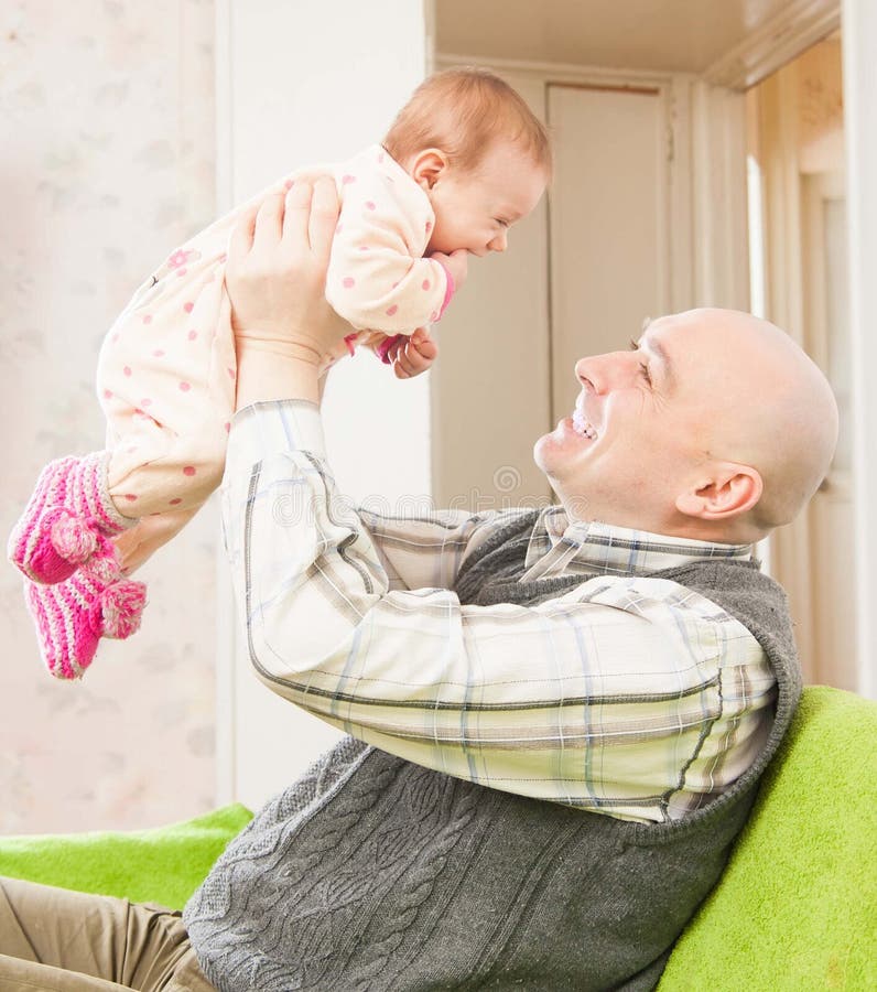 Happy dad with baby stock image. Image of hugging, sitting - 37444035