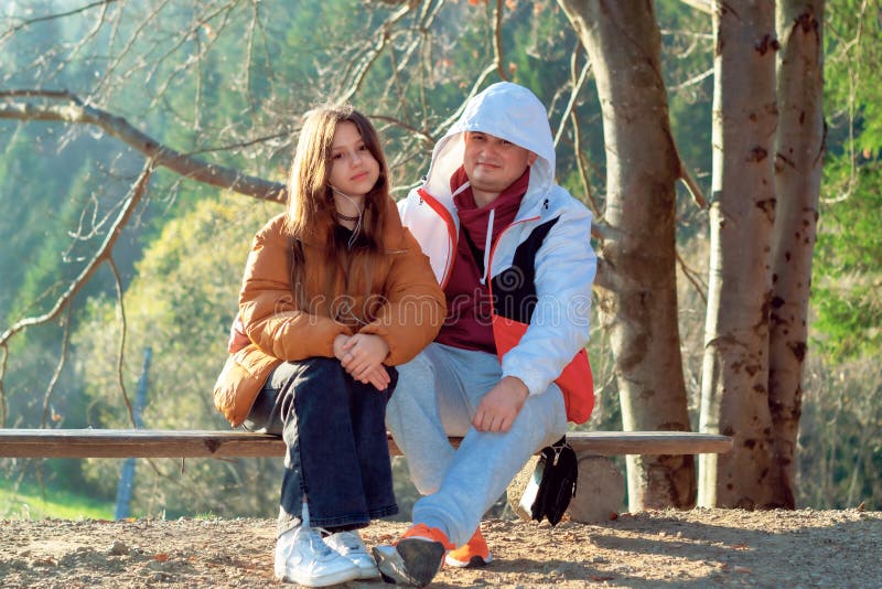 Happy Dad and Teenage Daughter on a Bench in the Forest. Stock Image ...