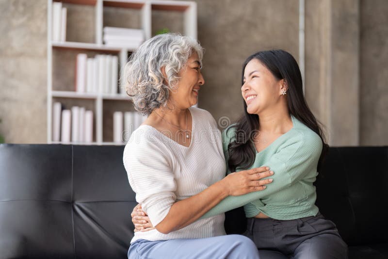 Happy Daughter And Mother Having Fun In Living Room Smiling Mother