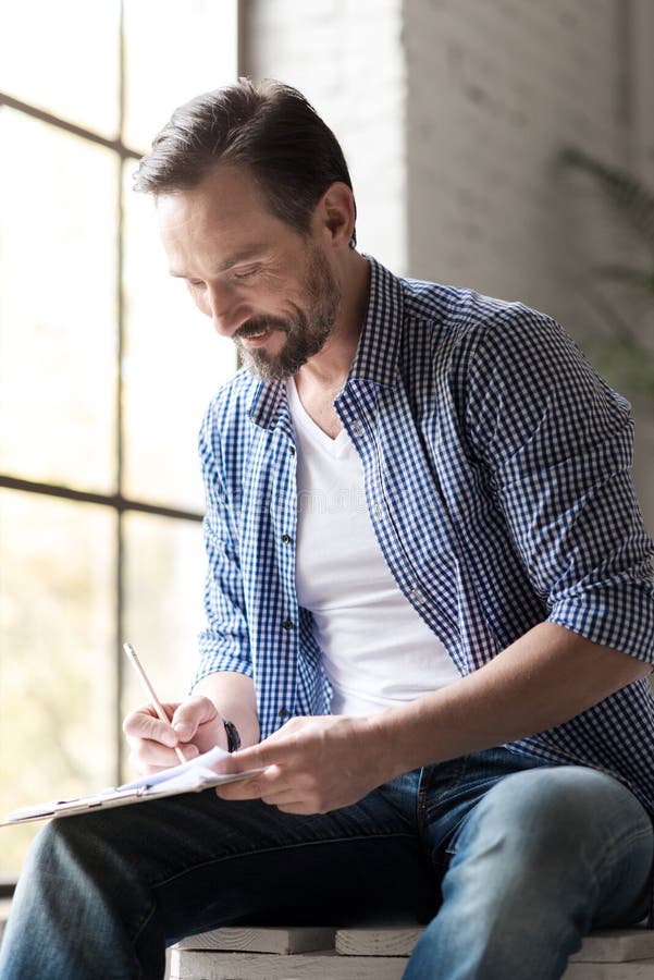 Happy Delighted Man Writing with a Pencil Stock Photo - Image of ...