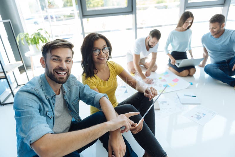 Happy Delighted People Sitting on the Floor Stock Photo - Image of ...