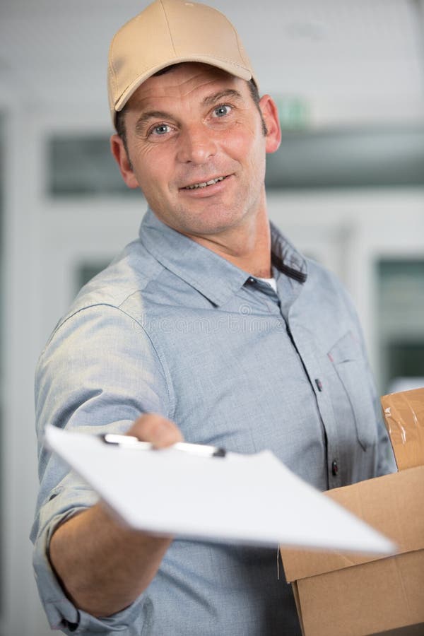 Happy Delivery Man Asking for Signature Stock Image - Image of sign ...