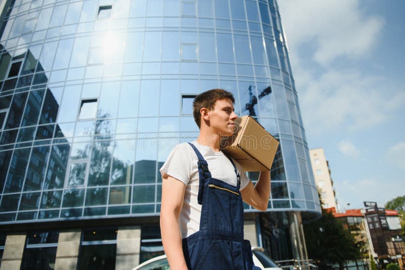 Happy Delivery Man with Box Stock Photo - Image of industry, cheerful ...