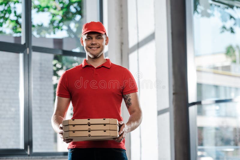 Happy Delivery Man in Cap and Stock Photo - Image of profession ...