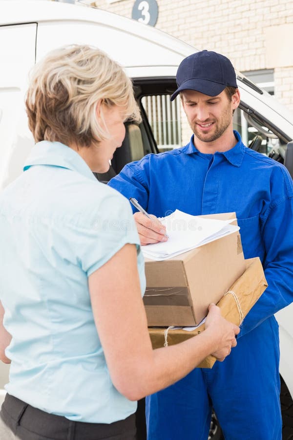 Happy Delivery Man Giving Package To Customer Stock Image - Image of ...