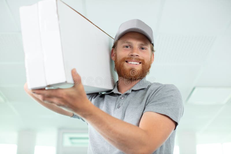 Happy Delivery Man Holding Box Package Stock Photo - Image of ...