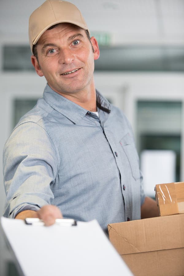 Happy Delivery Man Holding Boxes Stock Image - Image of shipping ...