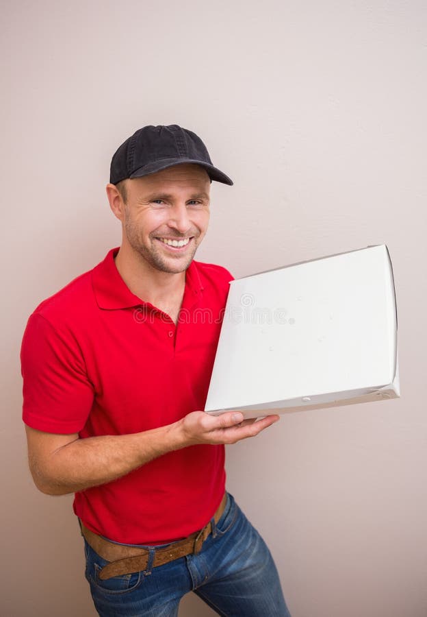Happy Delivery Man Holding Pizza Stock Image - Image of happy, food ...