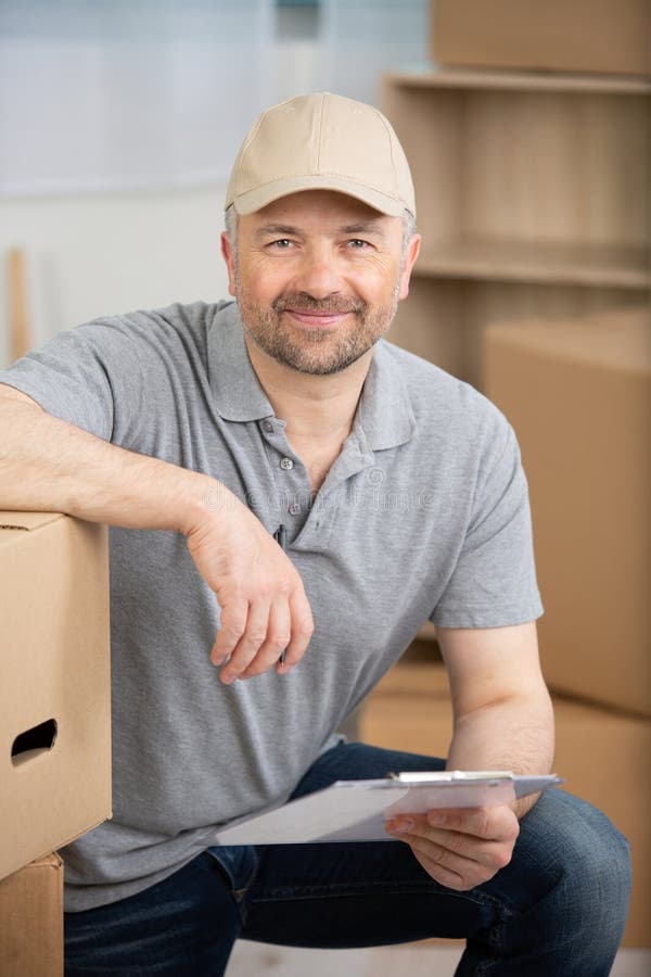 Happy Delivery Man Posing with Cardboard Boxes Stock Image - Image of ...