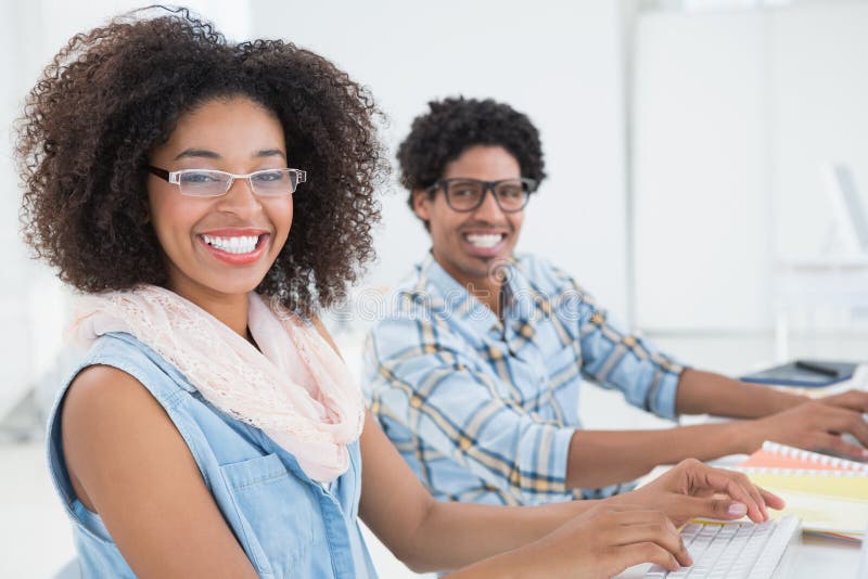 Happy Design Team Working at Desk Together Stock Photo - Image of ...