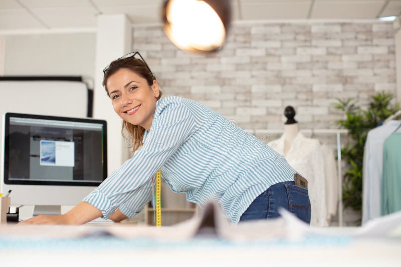 Happy designer at work stock image. Image of clothing - 309755183