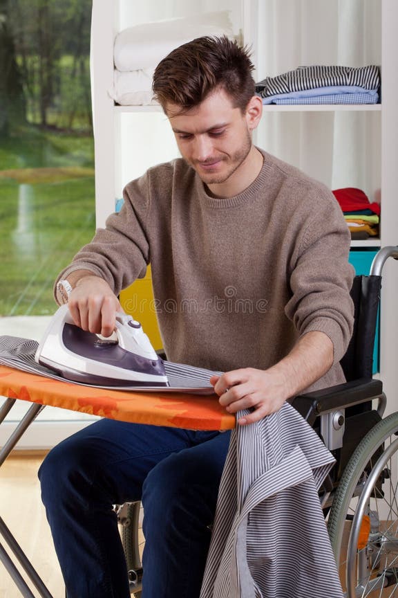 Happy Disabled Man during Ironing Stock Photo - Image of caucasian ...