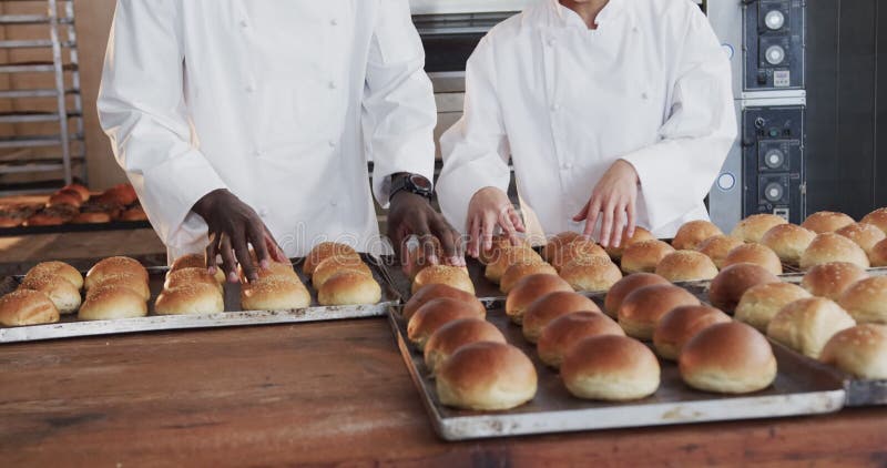 Happy Diverse Bakers Working in Bakery Kitchen, Counting Fresh Rolls in ...