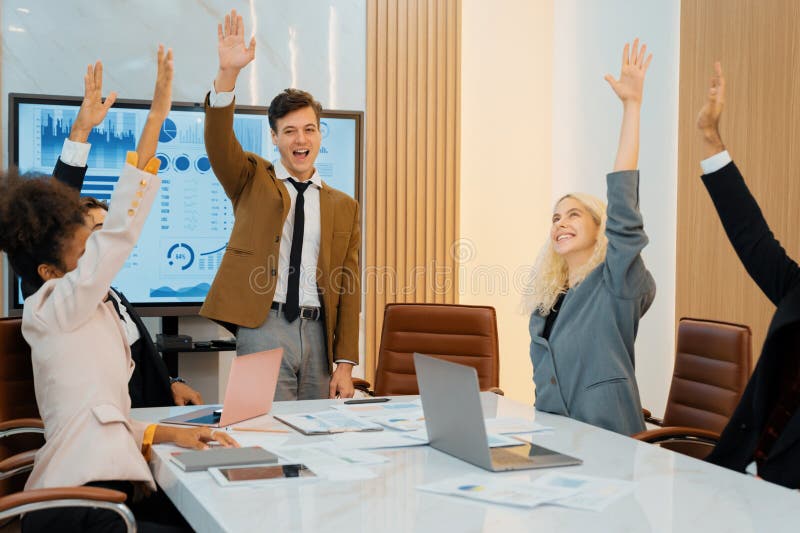 Happy Diverse Business Team Raising Hand Up at Meeting Room. Closeup ... Happy Diverse Business Team Raising Hand Up at Meeting Room. Closeup ...