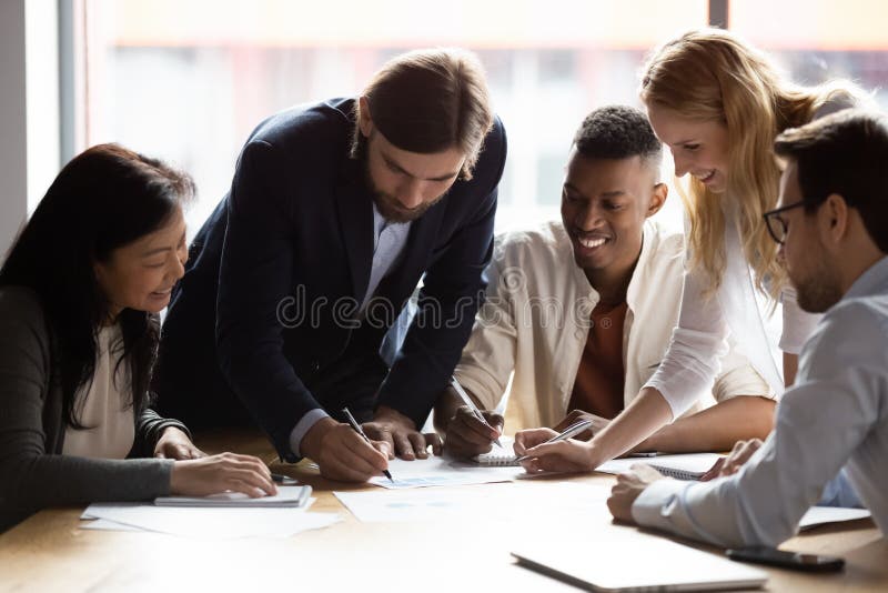 Happy Diverse Employees Working with Documents Together Stock Photo ...