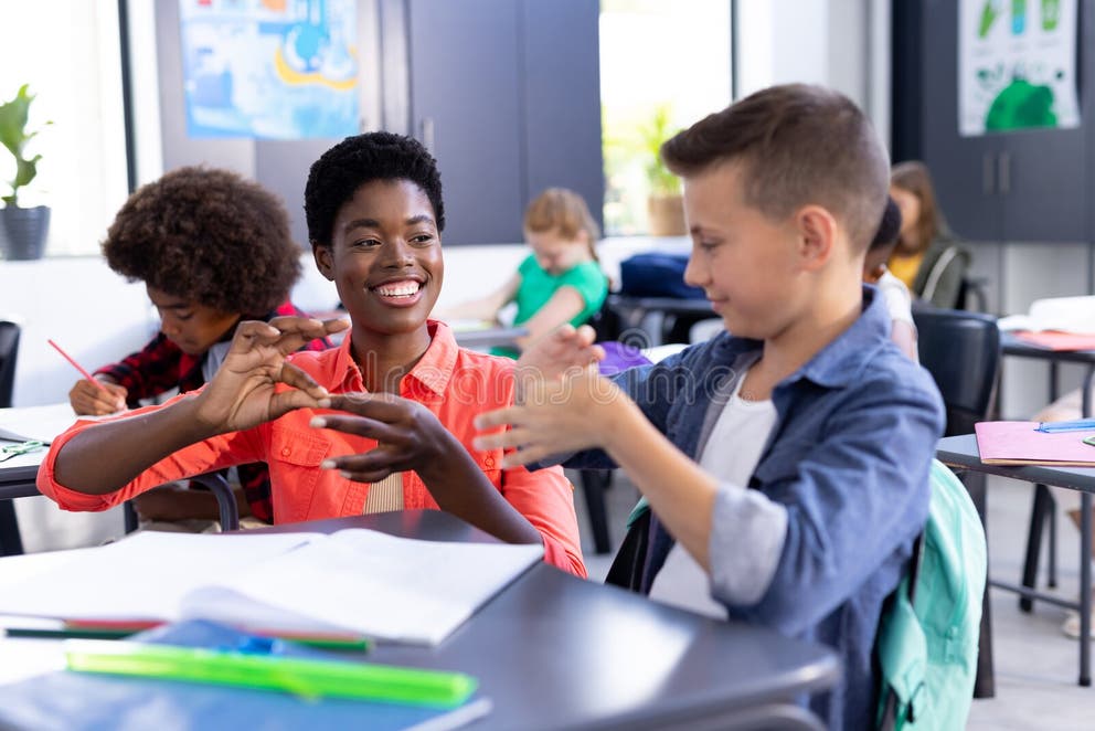 Happy, Diverse Female School Teacher and Boy Practicing Sign Language ...