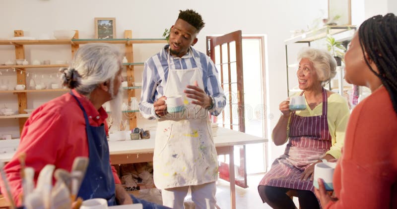 Happy Diverse Group of Potters Having Break and Discussing in Pottery ...
