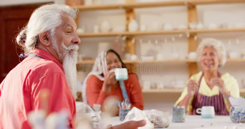 Happy Diverse Group of Potters Having Break and Discussing in Pottery ...