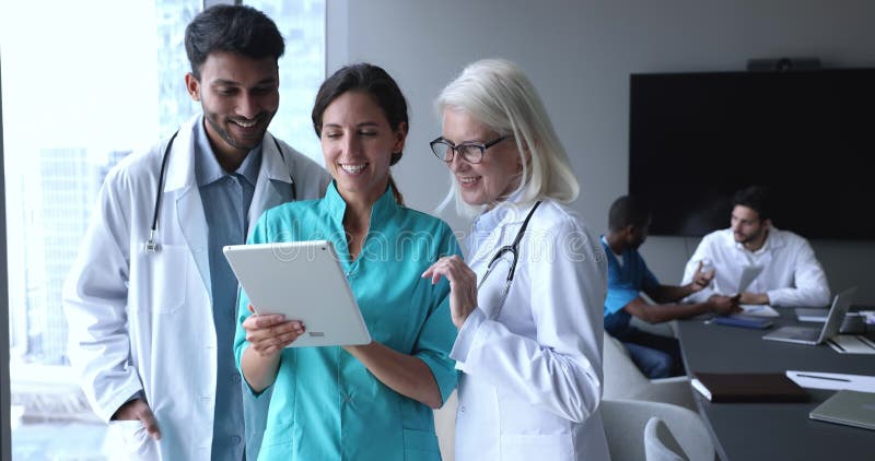 Happy Diverse Team of Doctors Walking in Hospital Hall Together Stock ...