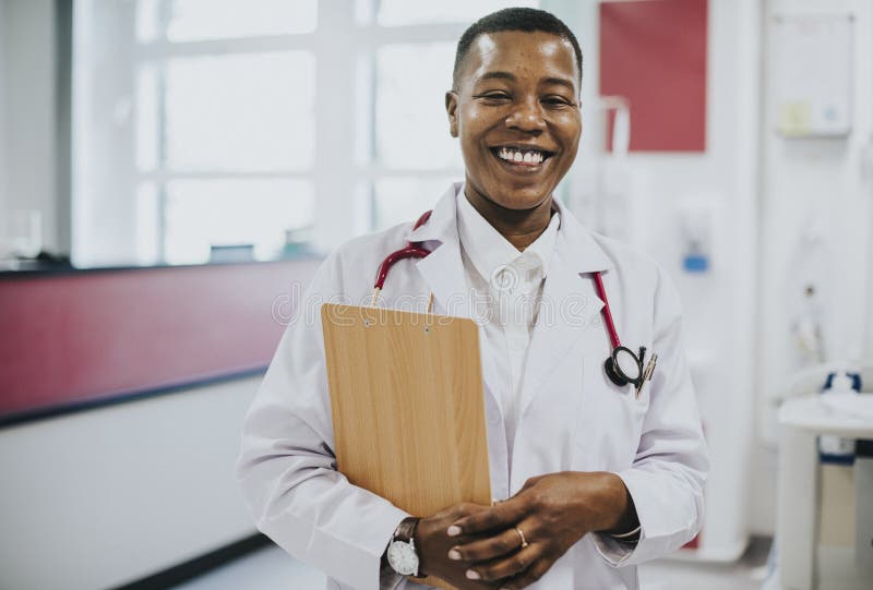 Happy doctor at a hospital stock image. Image of healthcare - 130819181