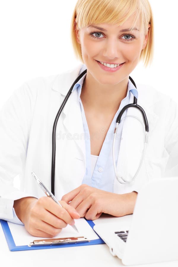 Doctor Doing Paperwork On Computer Sitting On Desk Stock Photo - Image ...