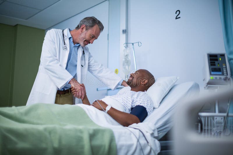 Happy Doctor and Patient Shaking Hand in Ward Stock Photo - Image of ...