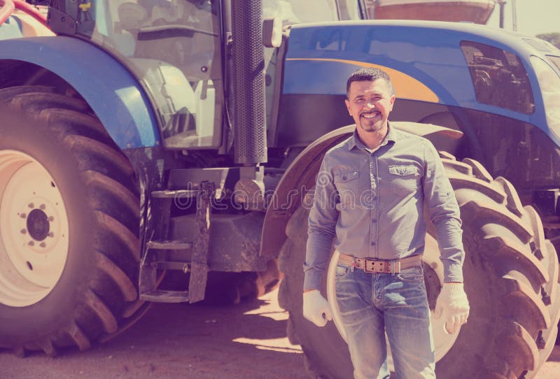 Happy Driver Farmer Standing with Big Tractor Stock Photo - Image of ...
